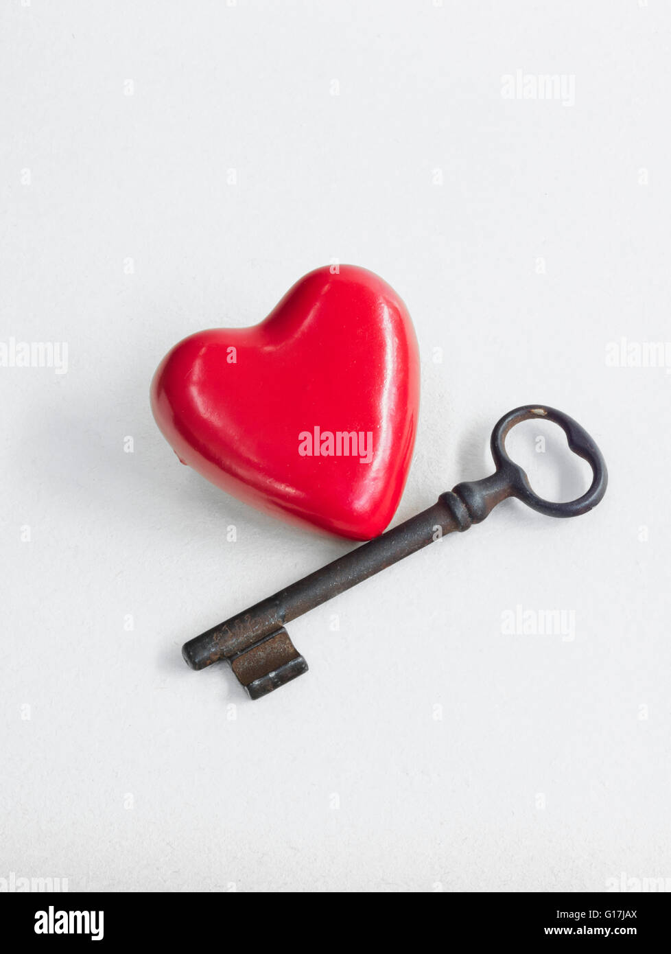 Red heart next to an old key on isolated white background Stock Photo ...