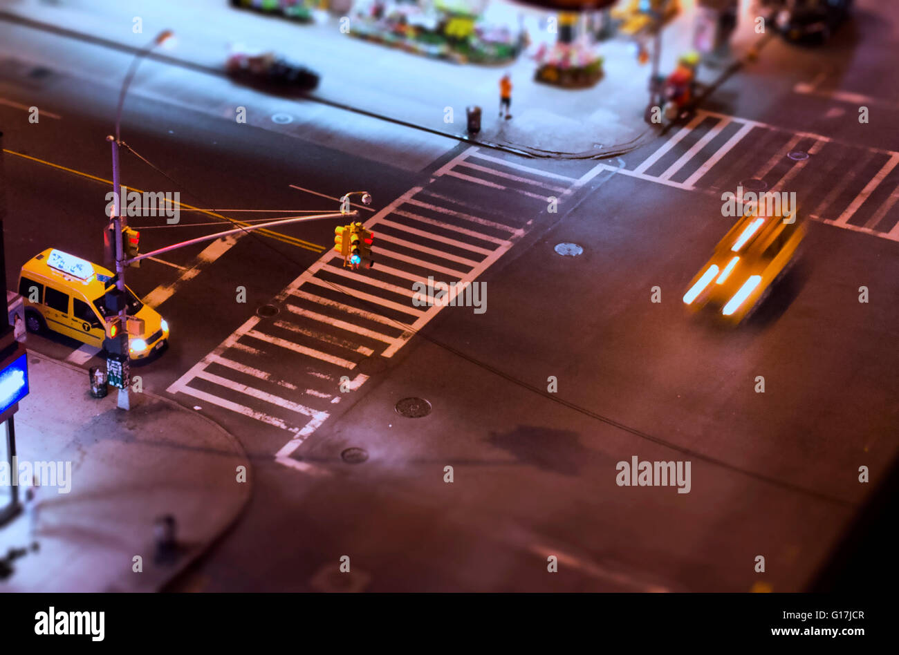 A bustling city intersection at night, transformed into a dreamy ...