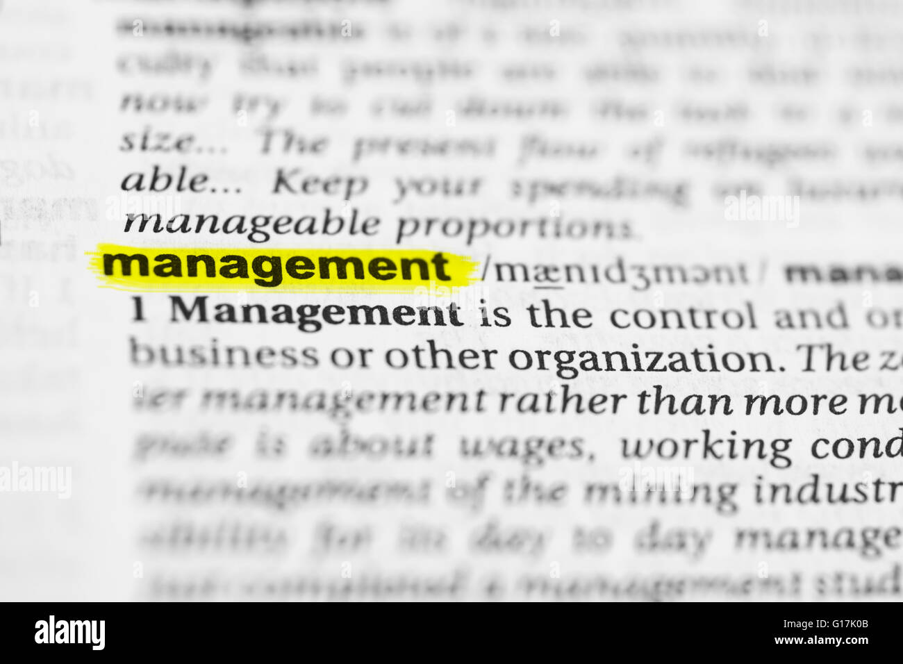 Detail of the english word "management" highlighted and its definition ...