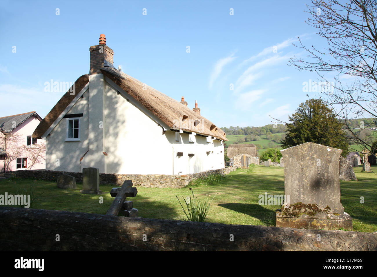 An ancient cottage in a rural Devon Village beside a churchyard with ...
