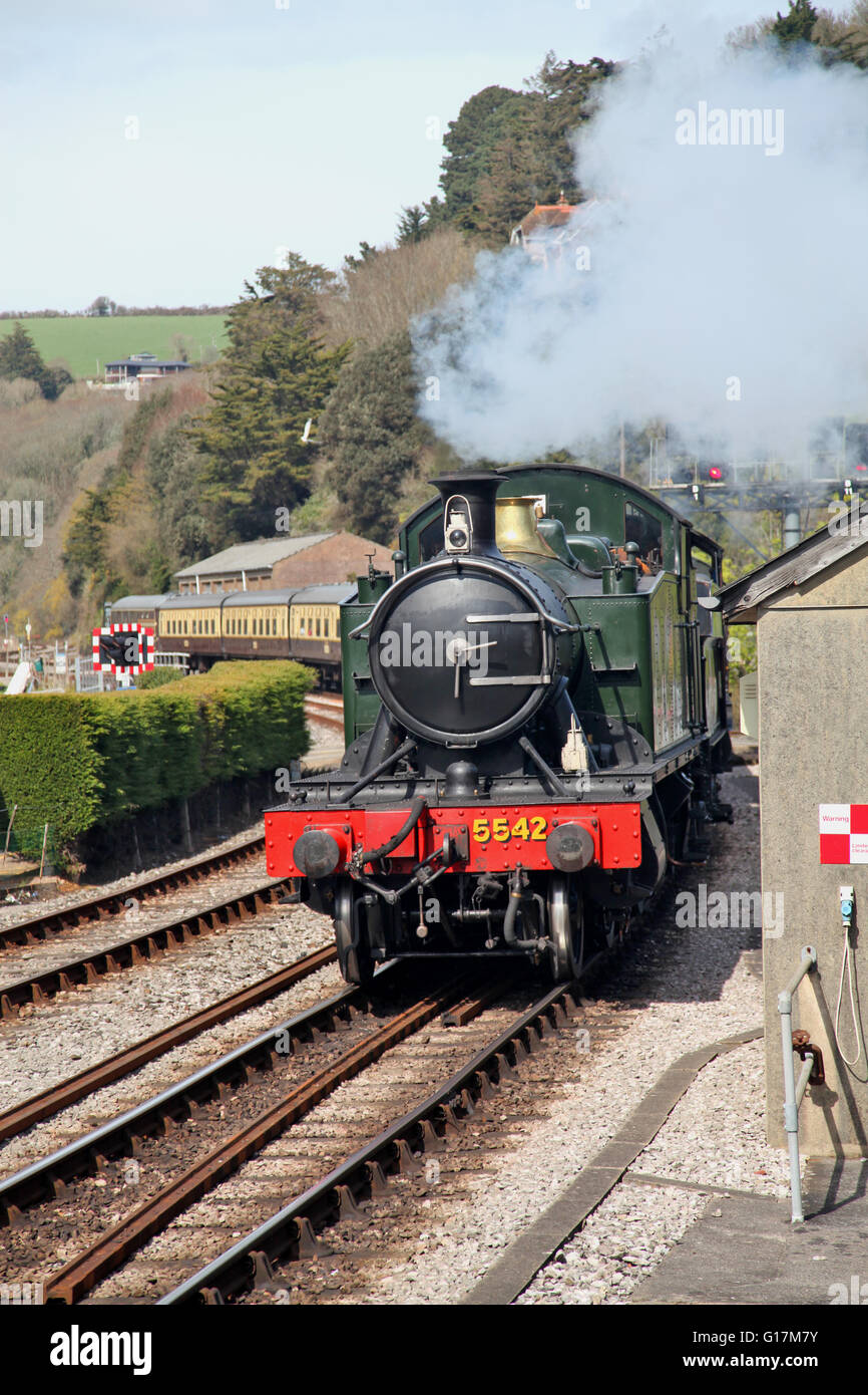A steam train approaches Kingswear, Devon loaded with holidaymakers ...