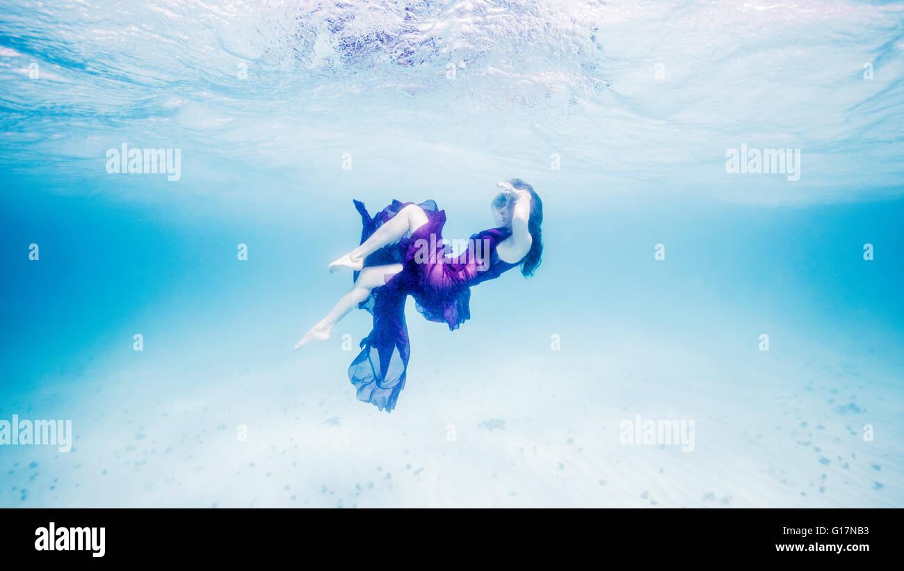 Woman wearing dress underwater in hi-res stock photography and images ...