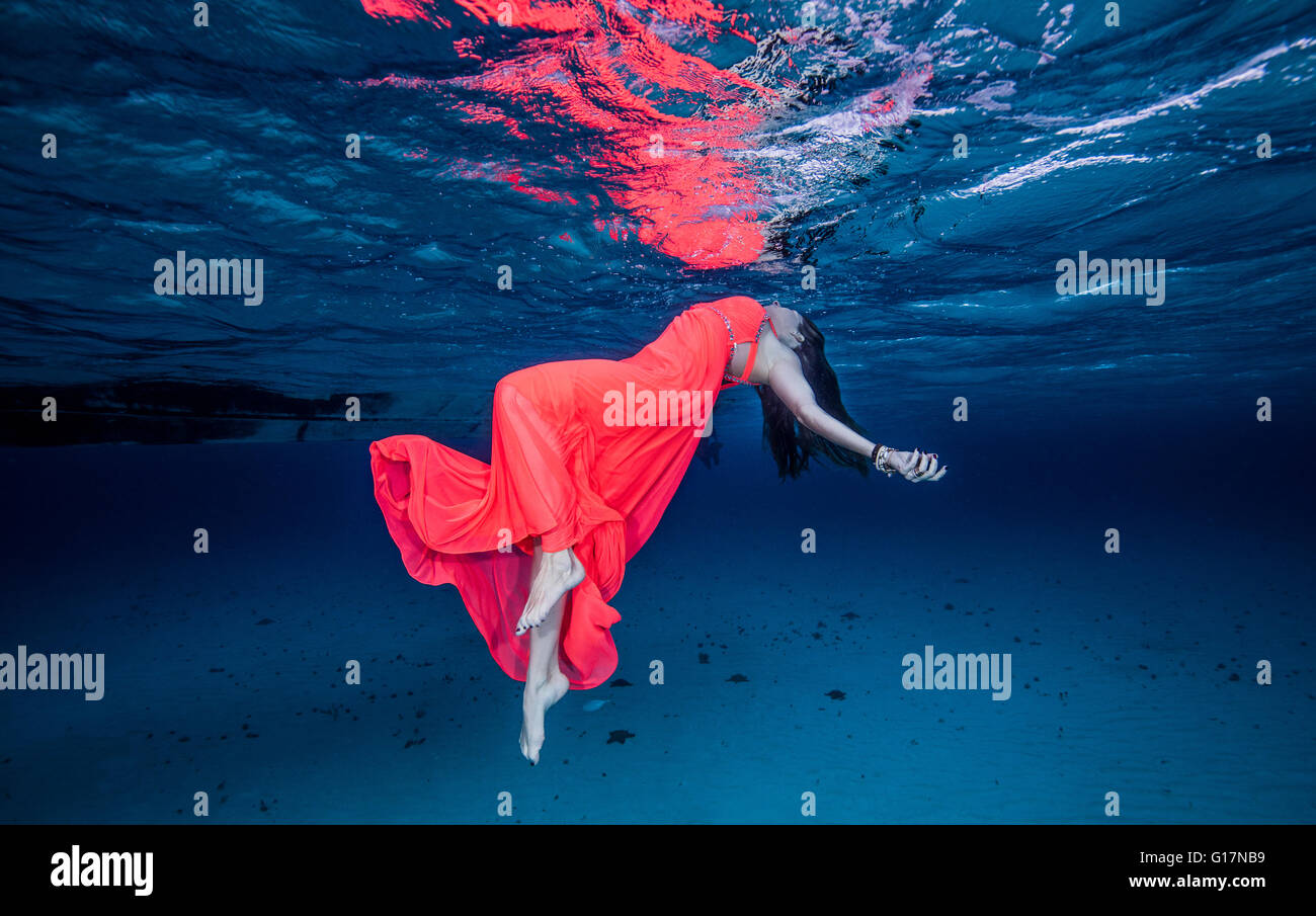 Woman in dress underwater hi-res stock photography and images - Alamy
