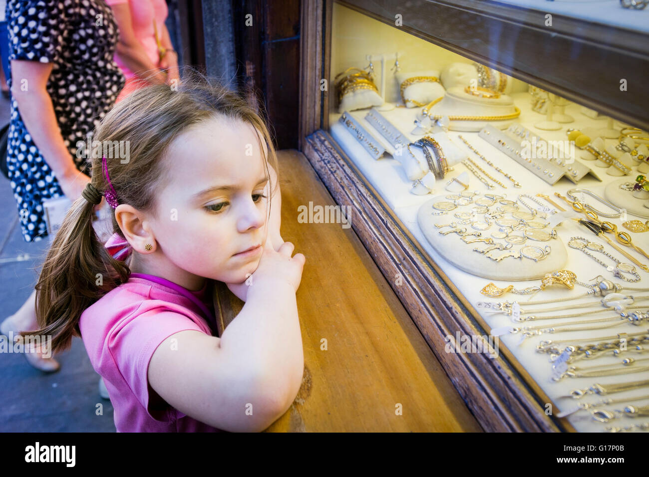 Girl staring at jewelry shop window, Florence, Italy Stock Photo - Alamy