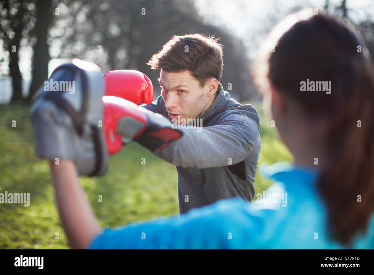 Two male boxing in park hi-res stock photography and images - Alamy