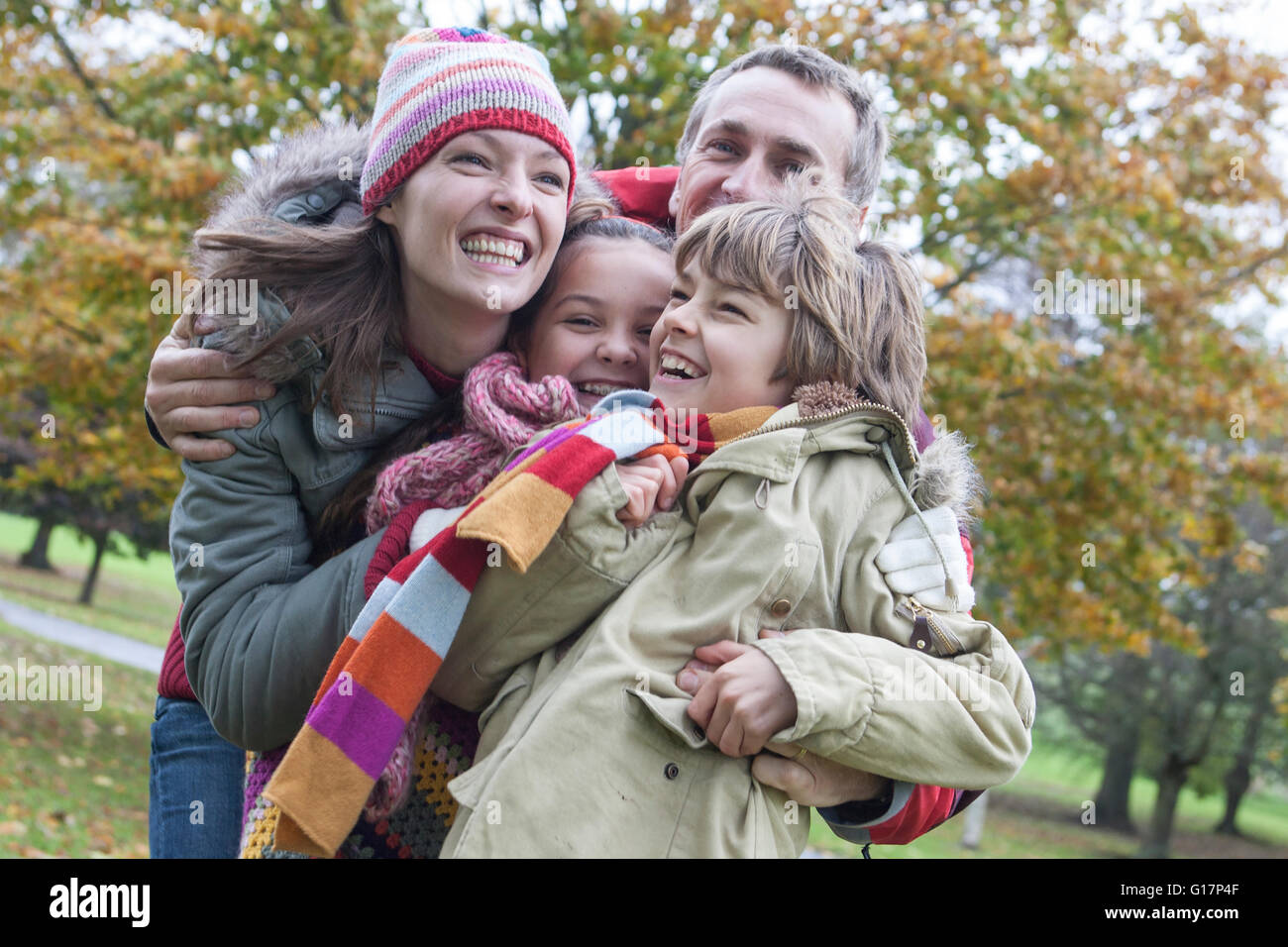 Family fooling around in park, laughing Stock Photo - Alamy