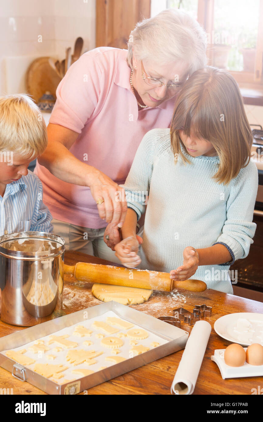 Grandmother and grandson making cookies hi-res stock photography and ...