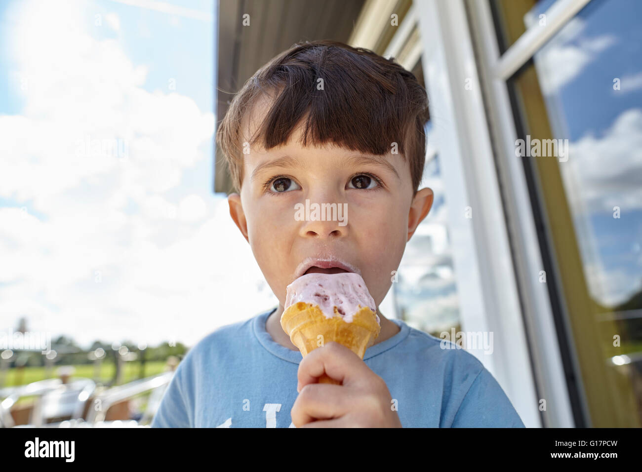 Boy licking ice cream cone hi-res stock photography and images - Alamy