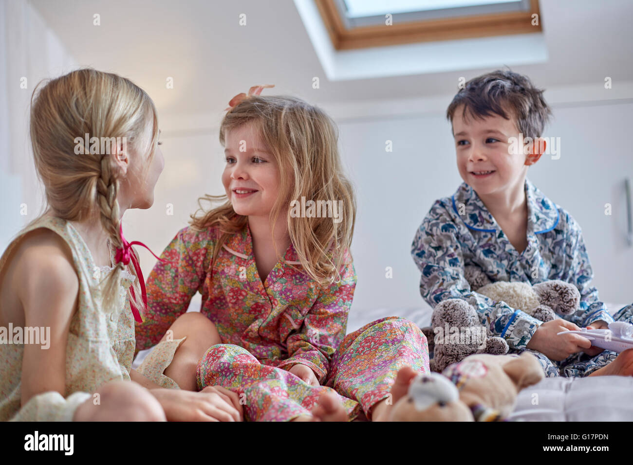 Children chatting in loft room Stock Photo - Alamy
