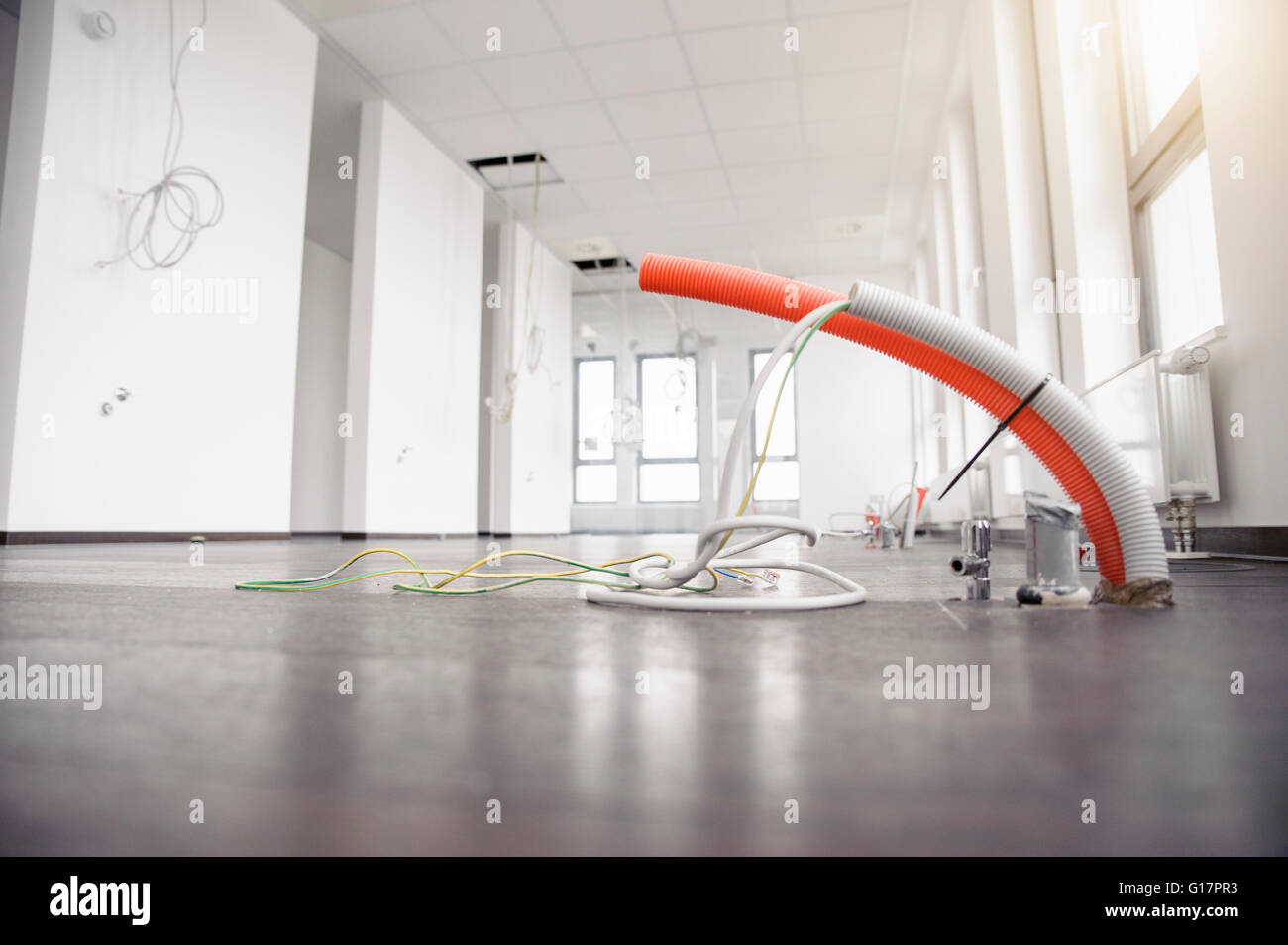 Surface level view of network and power cables protruding from new ...