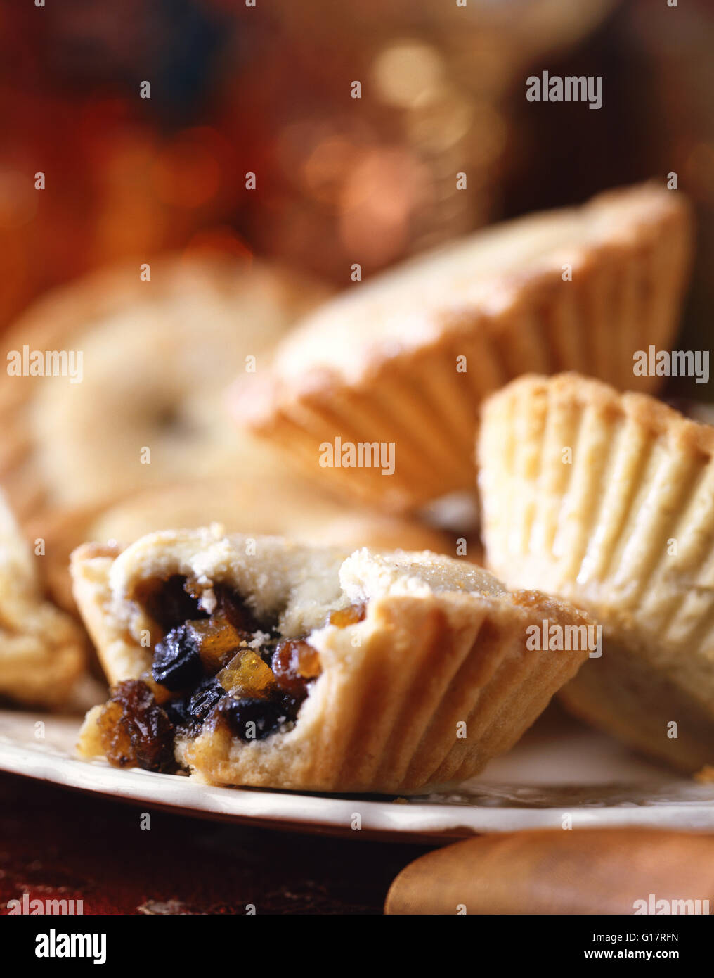 Plate of mince pies, missing bite Stock Photo - Alamy