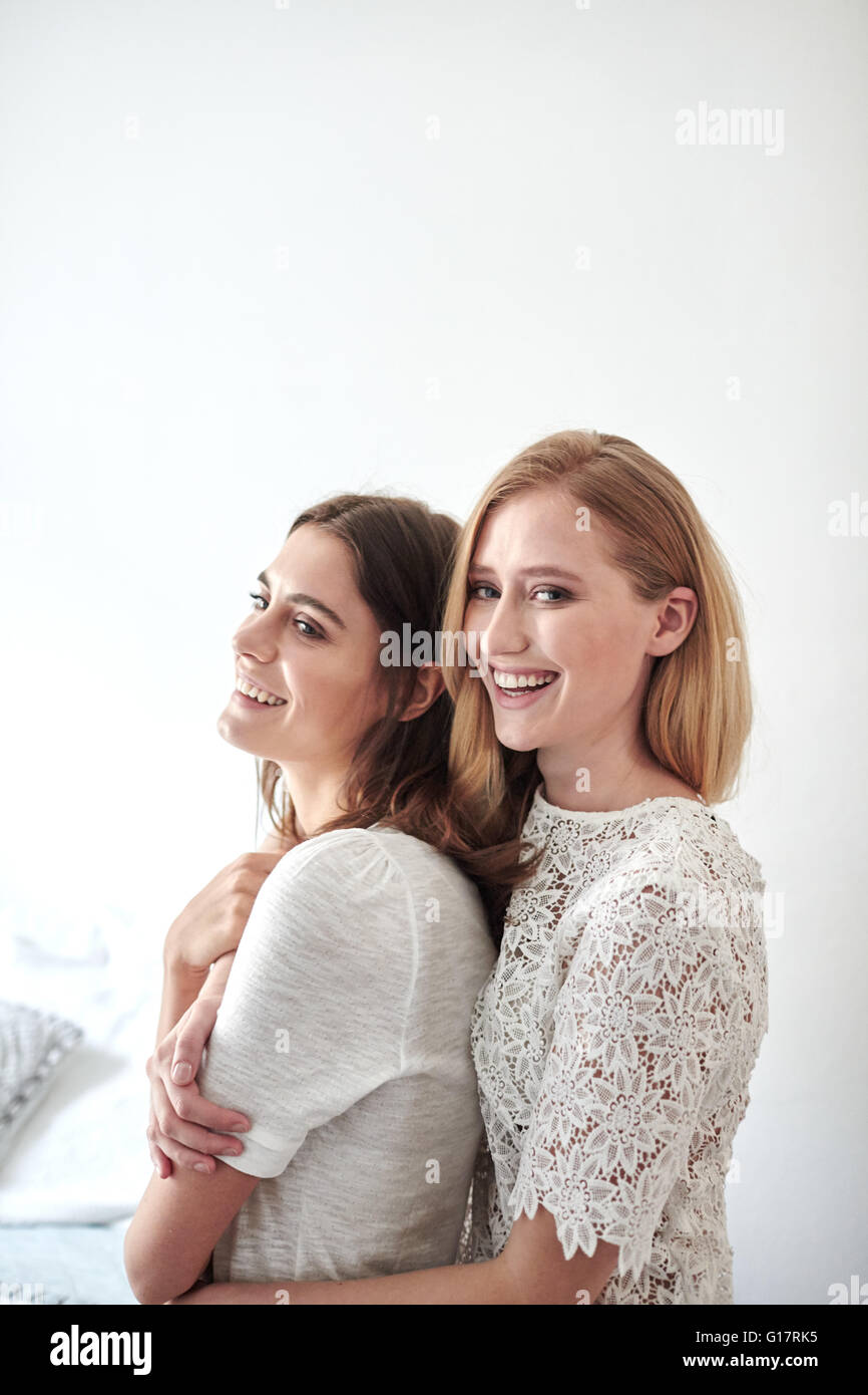 Side view portrait of two beautiful young women Stock Photo - Alamy
