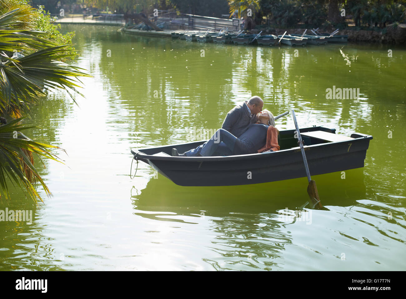 Older couple rowing boat hi-res stock photography and images - Alamy