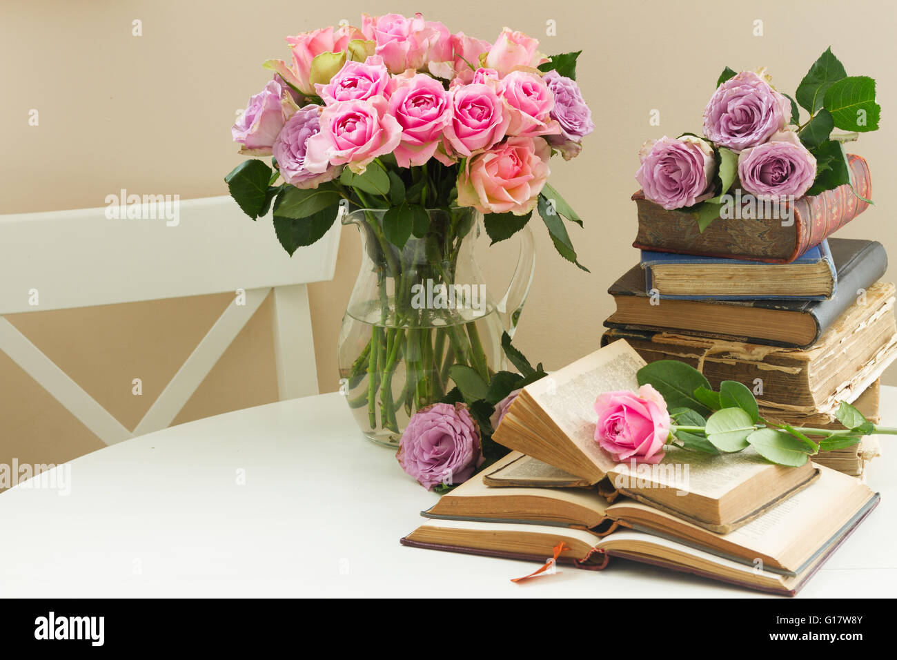 Old books with rose flower Stock Photo - Alamy