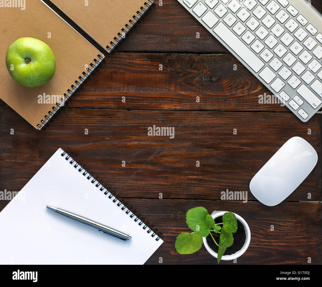 Dark Brown Wooden Desk with Stationery and Electronics Stock Photo - Alamy