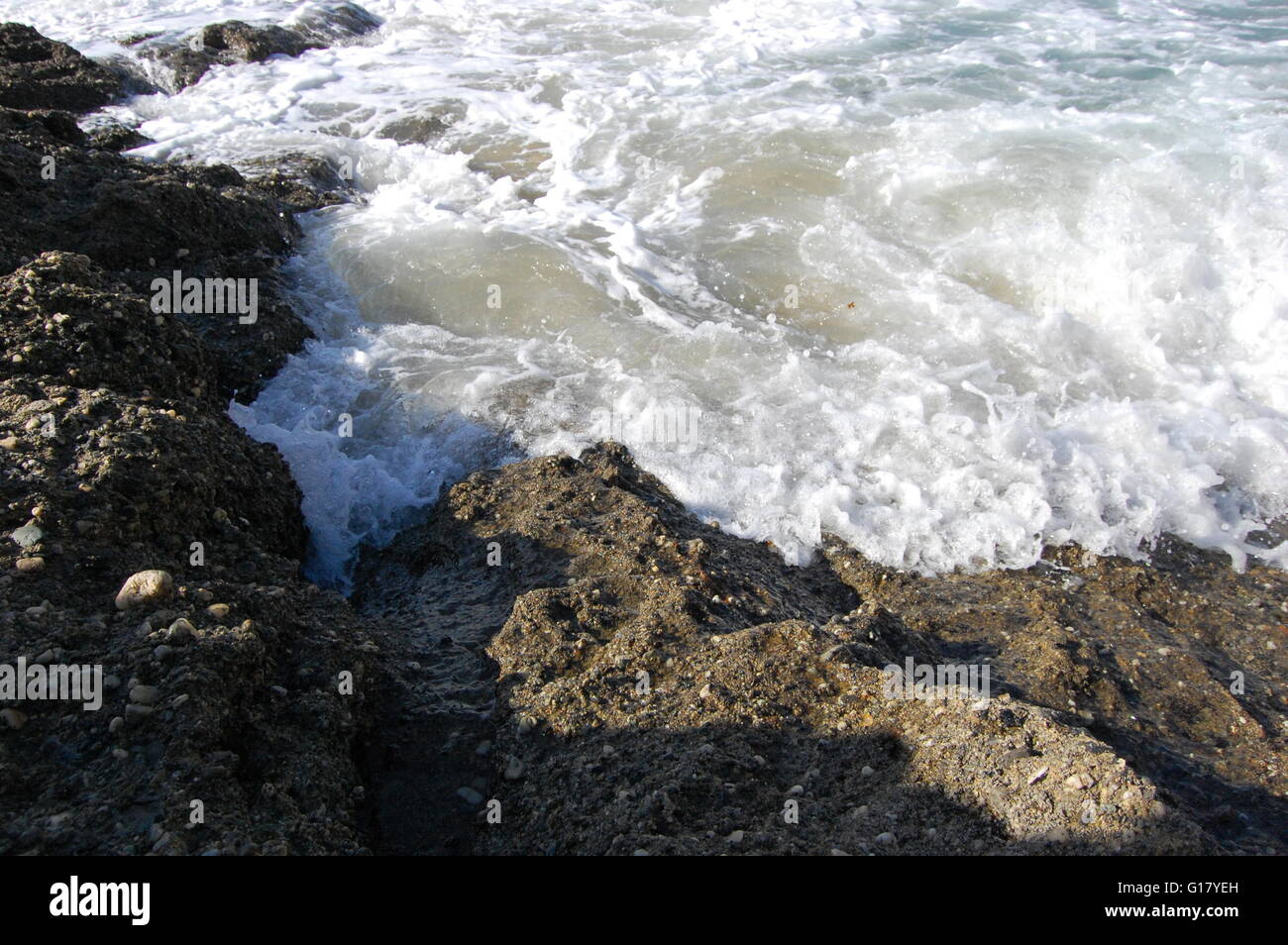 Water rolling over rocks hi-res stock photography and images - Alamy