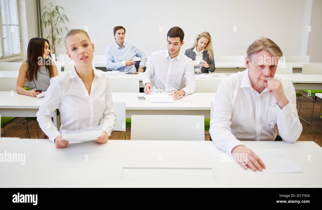 Worried business people before a test in a business seminar Stock Photo ...