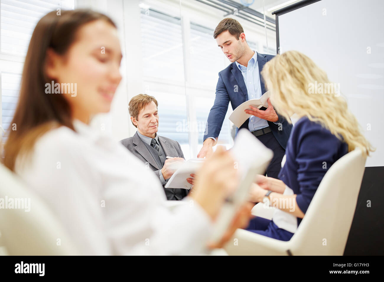 Teamwork from a team and a consultant in a business meeting Stock Photo ...