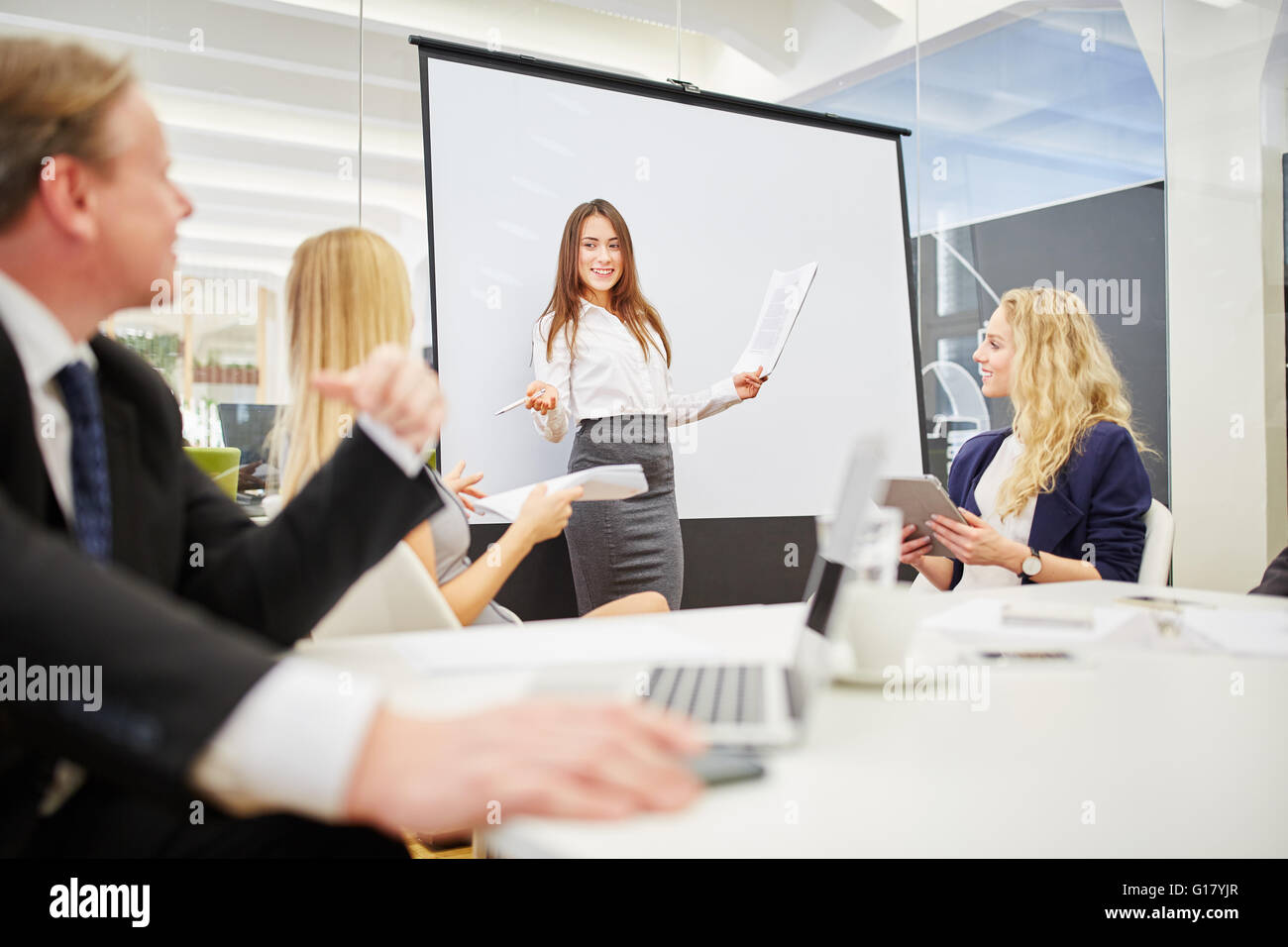 Woman giving lecture to woman office hi-res stock photography and ...