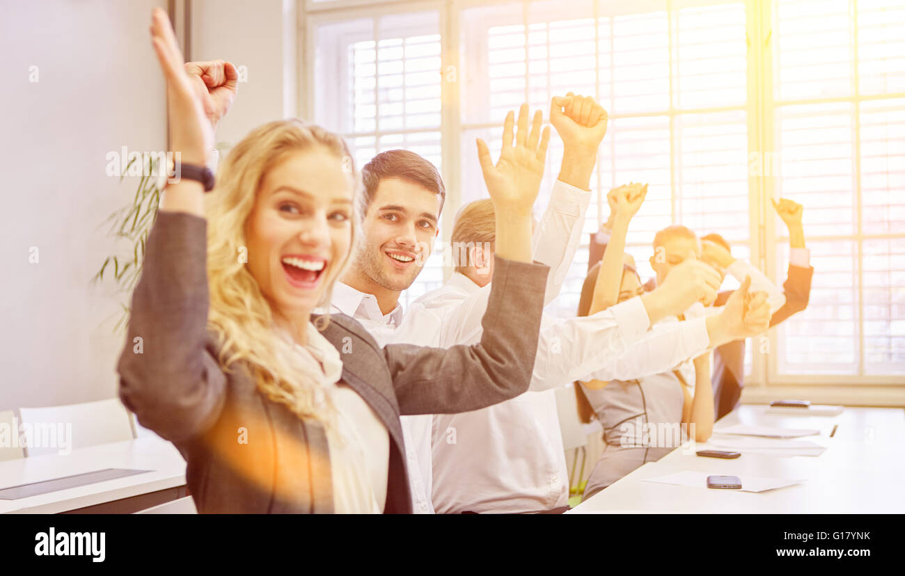 Cheering business people in a business team as winners Stock Photo - Alamy