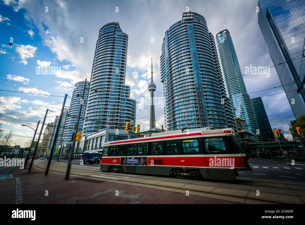 Streetcar on Queens Quay West and modern buildings at the Harbourfront ...