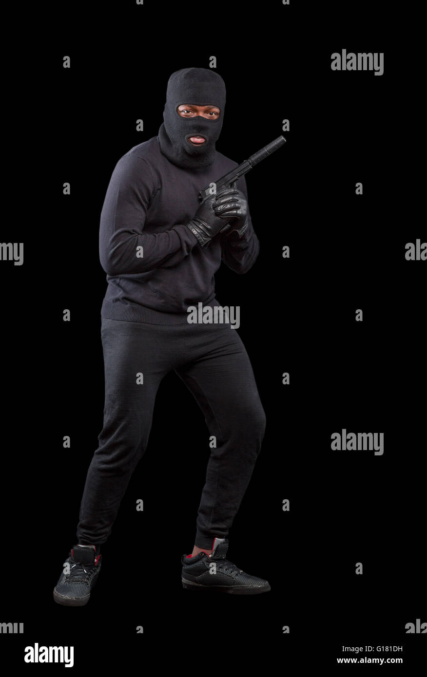 Masked man gun hi-res stock photography and images - Alamy
