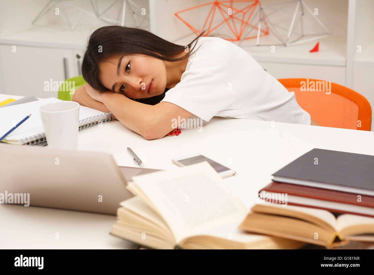 Tired Asian student Stock Photo - Alamy