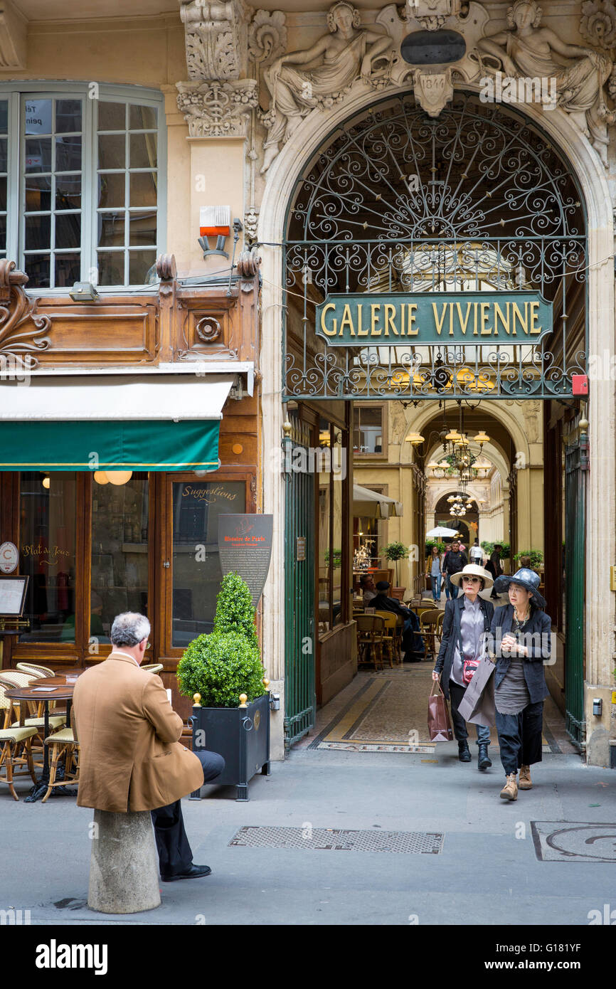 Two Asian tourists exit from Galerie Vivienne, Paris, France Stock ...