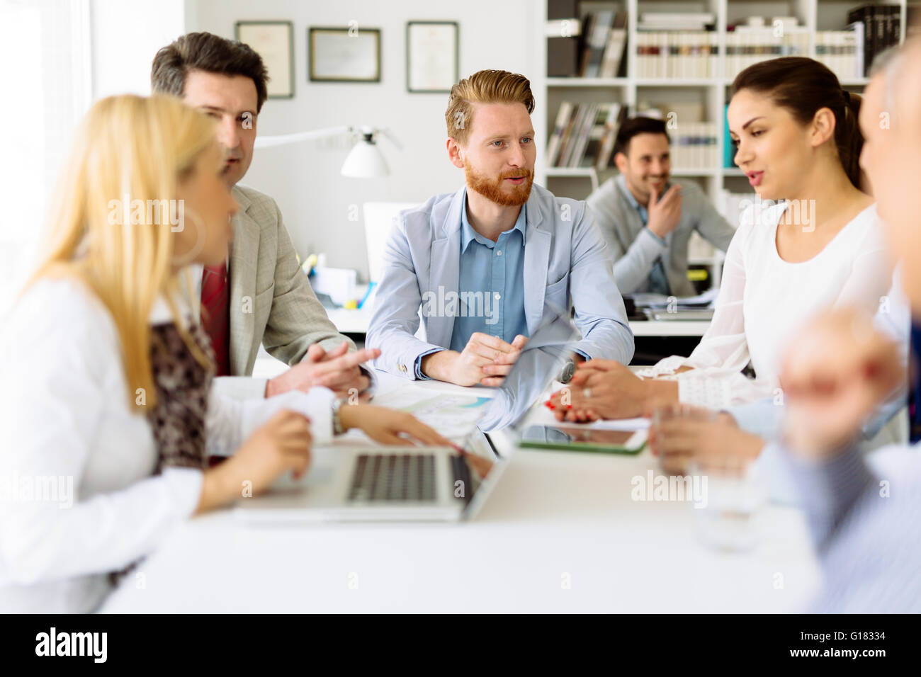 Succeful business partners brainstorming in office Stock Photo - Alamy