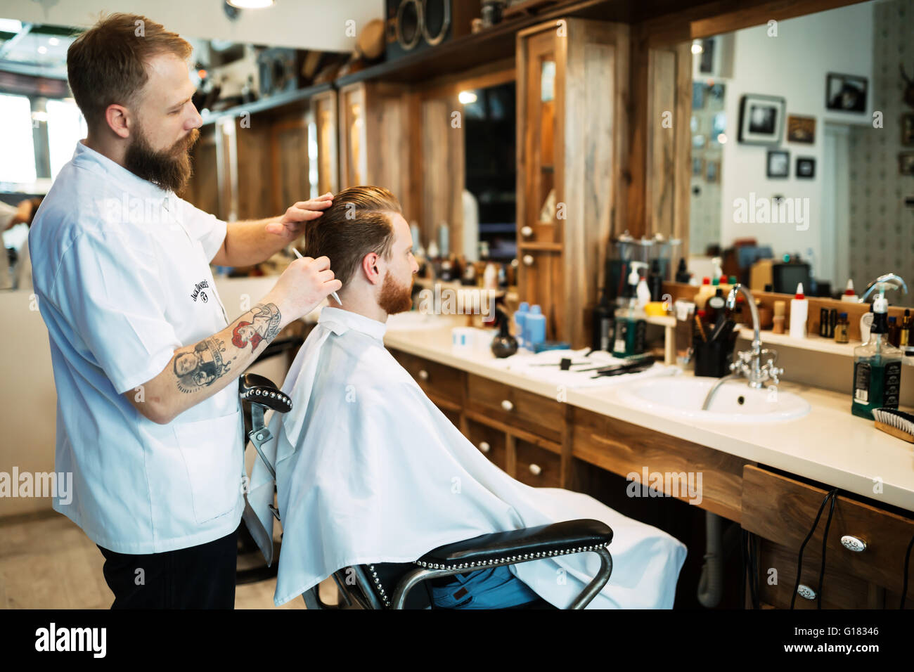 Hair beard and mustache treatment in barber shop Stock Photo - Alamy