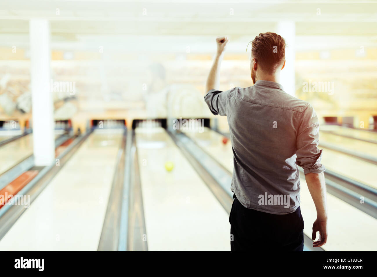 Conceptual image of a winner represented by male raising hand Stock ...