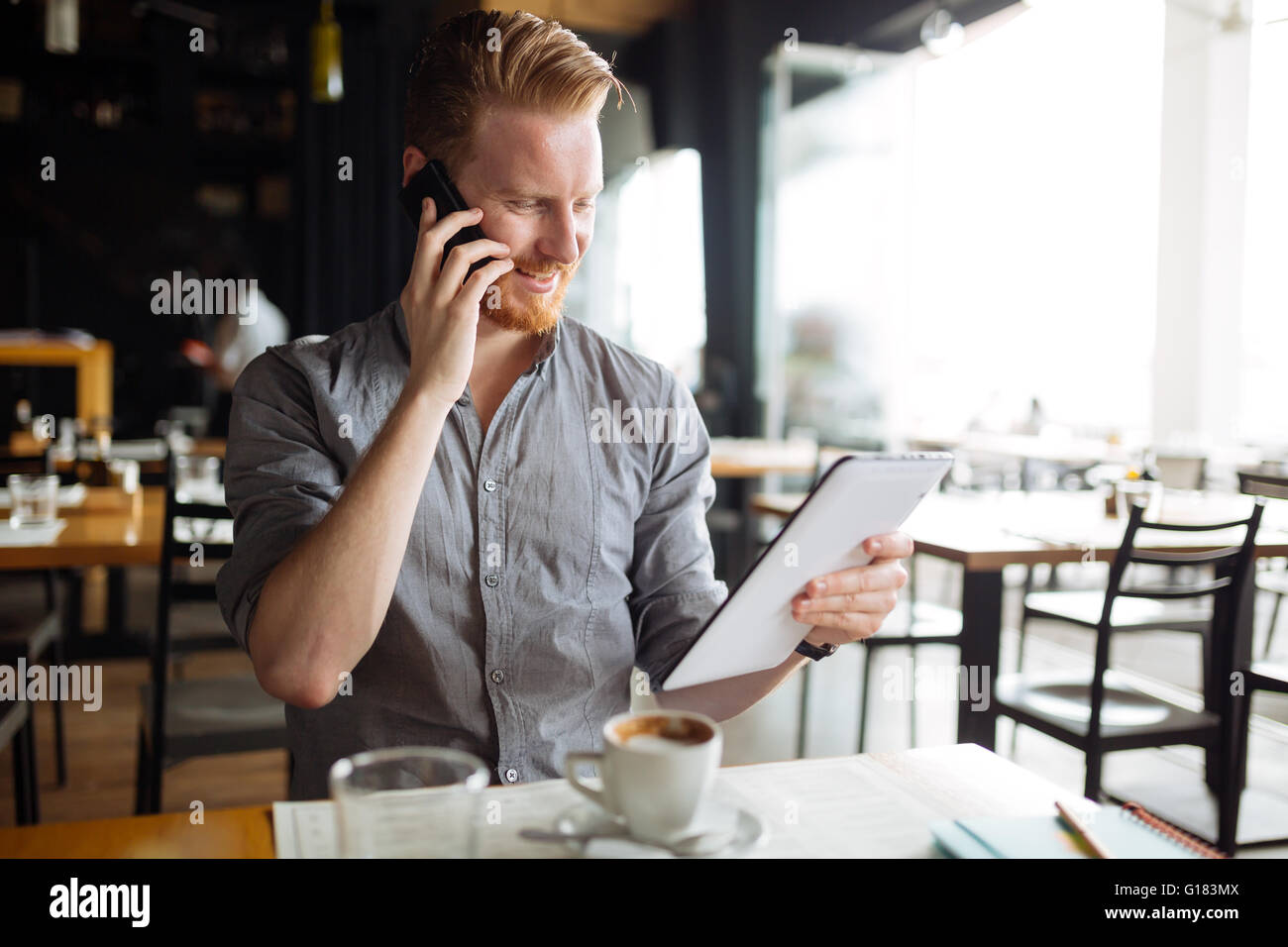 Businessman constantly busy and working Stock Photo - Alamy