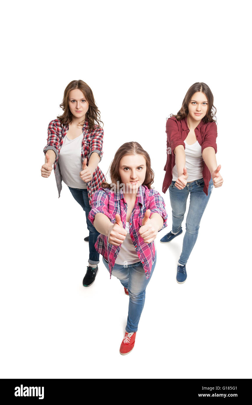 three young women posing over white background Stock Photo - Alamy
