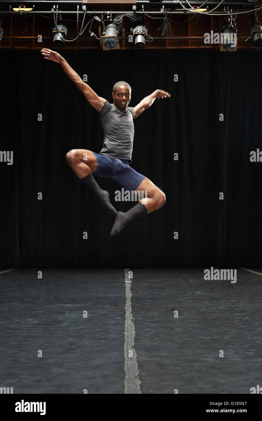 Dancer in midair pose Stock Photo - Alamy