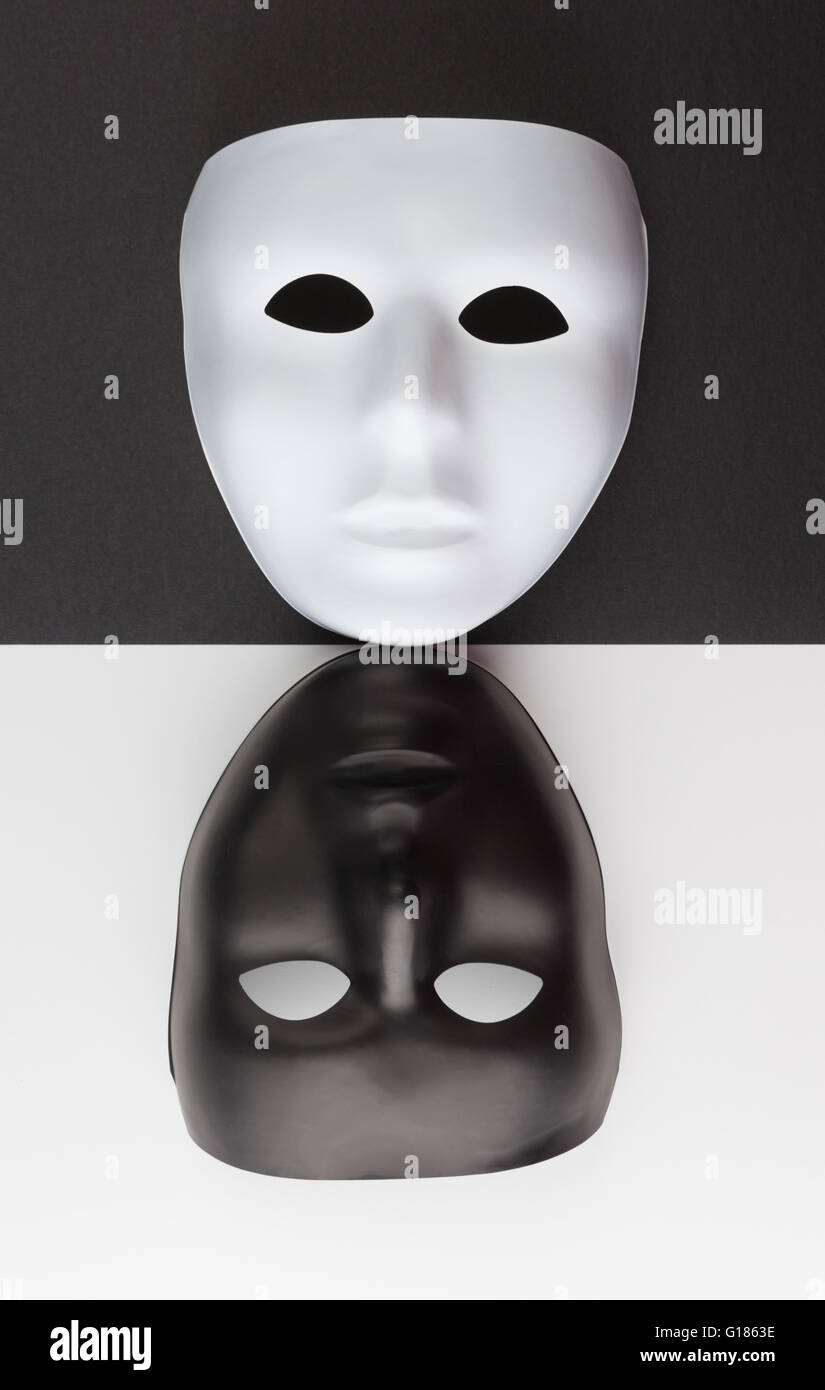 Black and white masks upside down on contrasting backgrounds ...