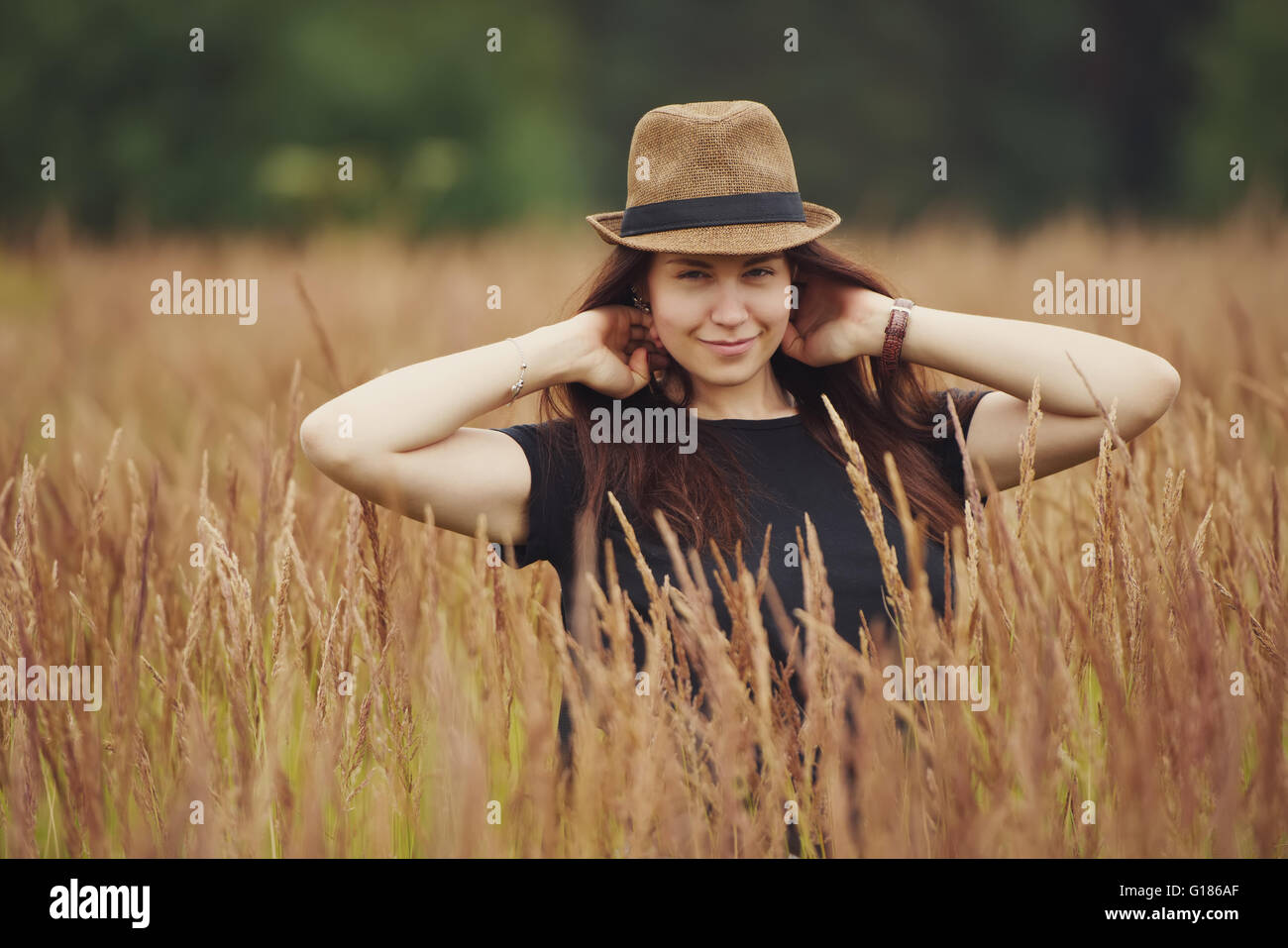 beautiful girl in high grass portrait Stock Photo - Alamy