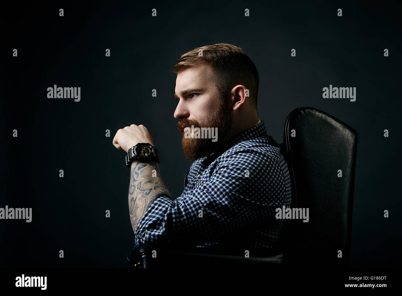 Thoughtful red bearded man studio portrait on dark background Stock ...