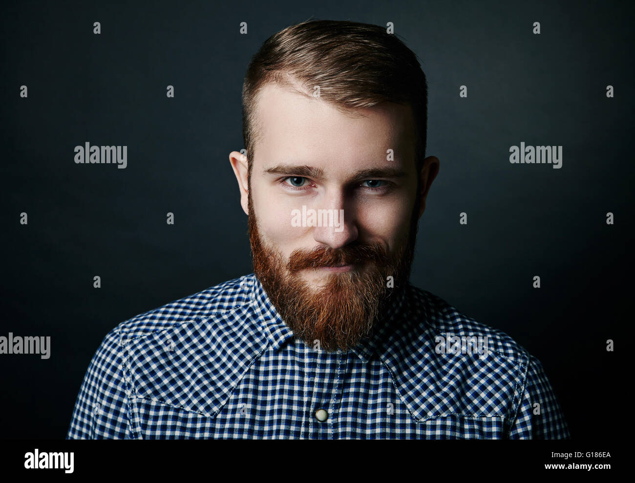 Smiling red bearded man studio portrait on dark background Stock Photo ...