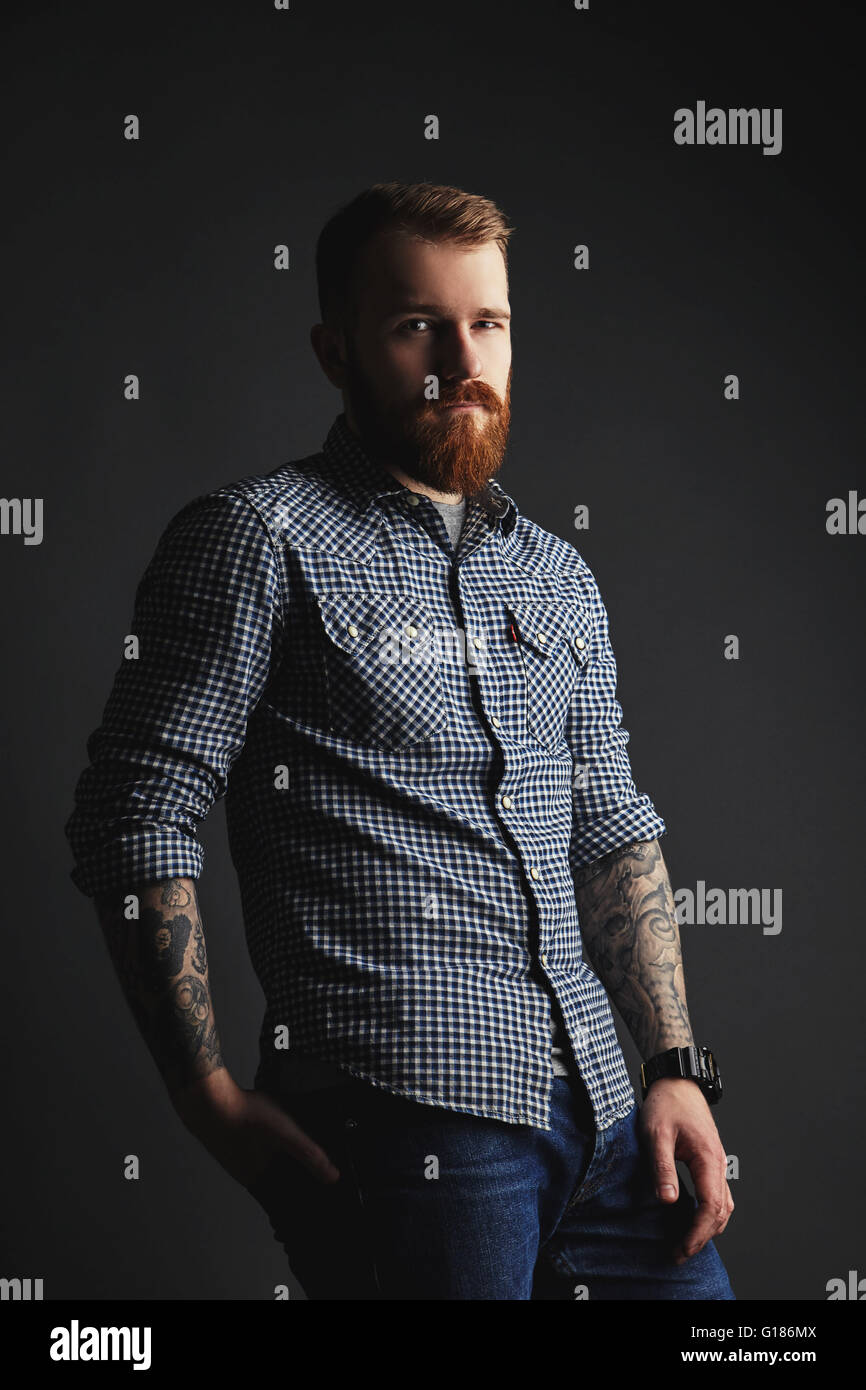 Red bearded man with tattoes studio portrait on dark background Stock ...