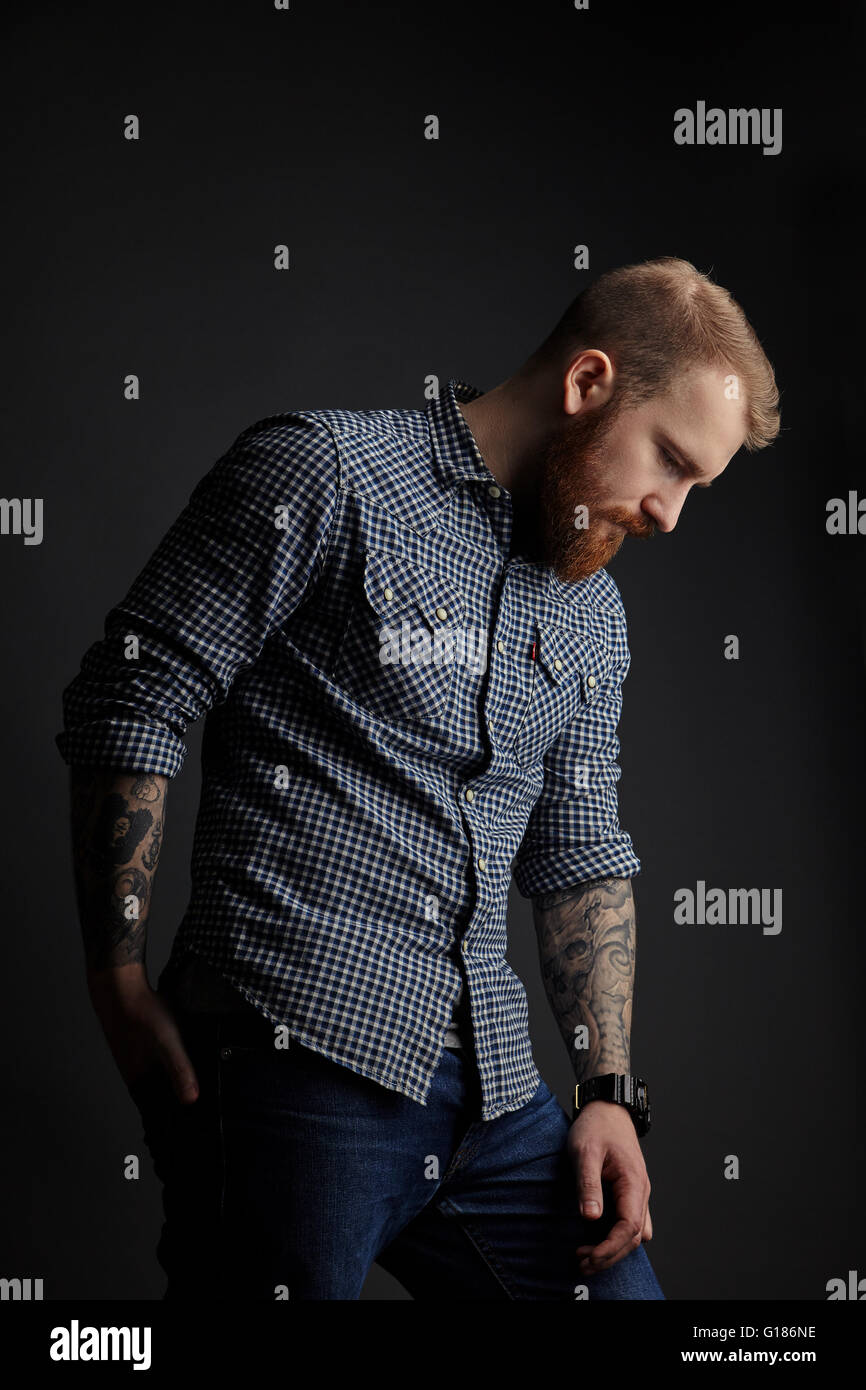 Pensive red bearded man studio portrait on dark background Stock Photo ...