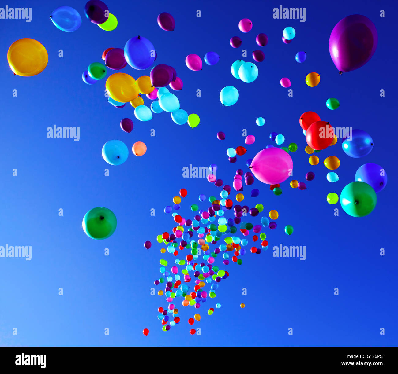 Colorful Balloons flying in the sky party Stock Photo - Alamy