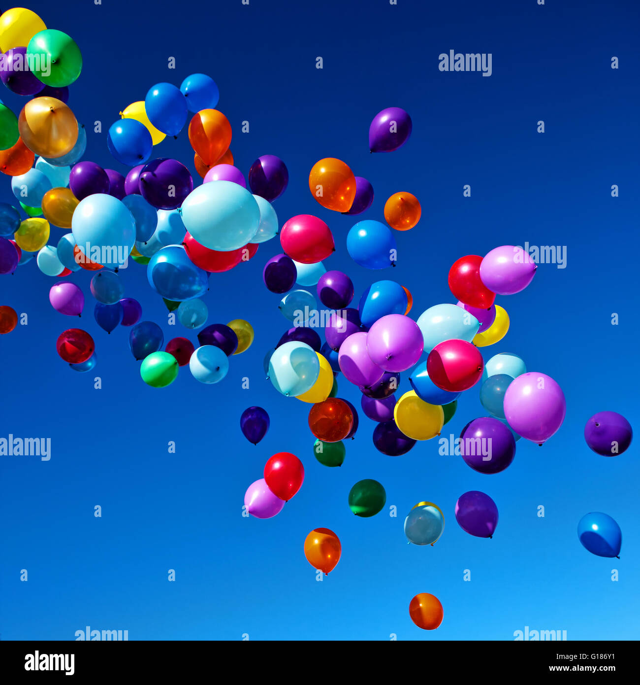 Colorful Balloons flying in the sky party Stock Photo - Alamy