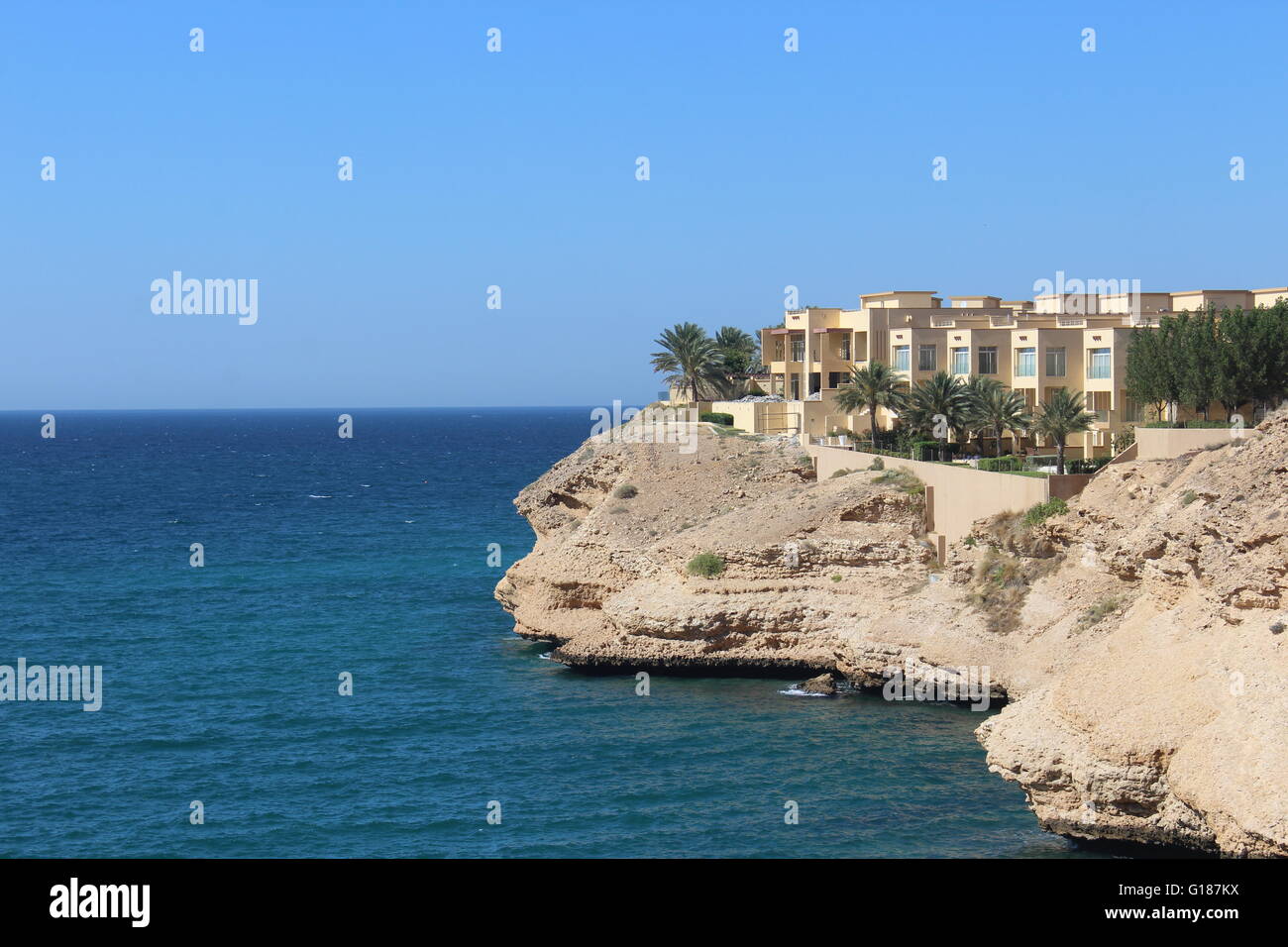 Cliff breaking into the ocean Stock Photo - Alamy