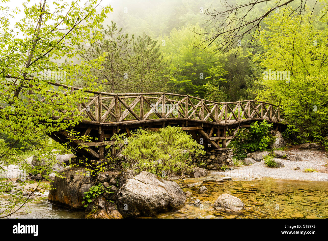 Wooden bridge over a river in the mountains of Olympus at Greece Stock ...