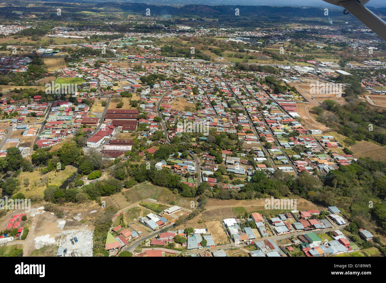 ALAJUELA, COSTA RICA - aerial view of housing and commercial activity ...