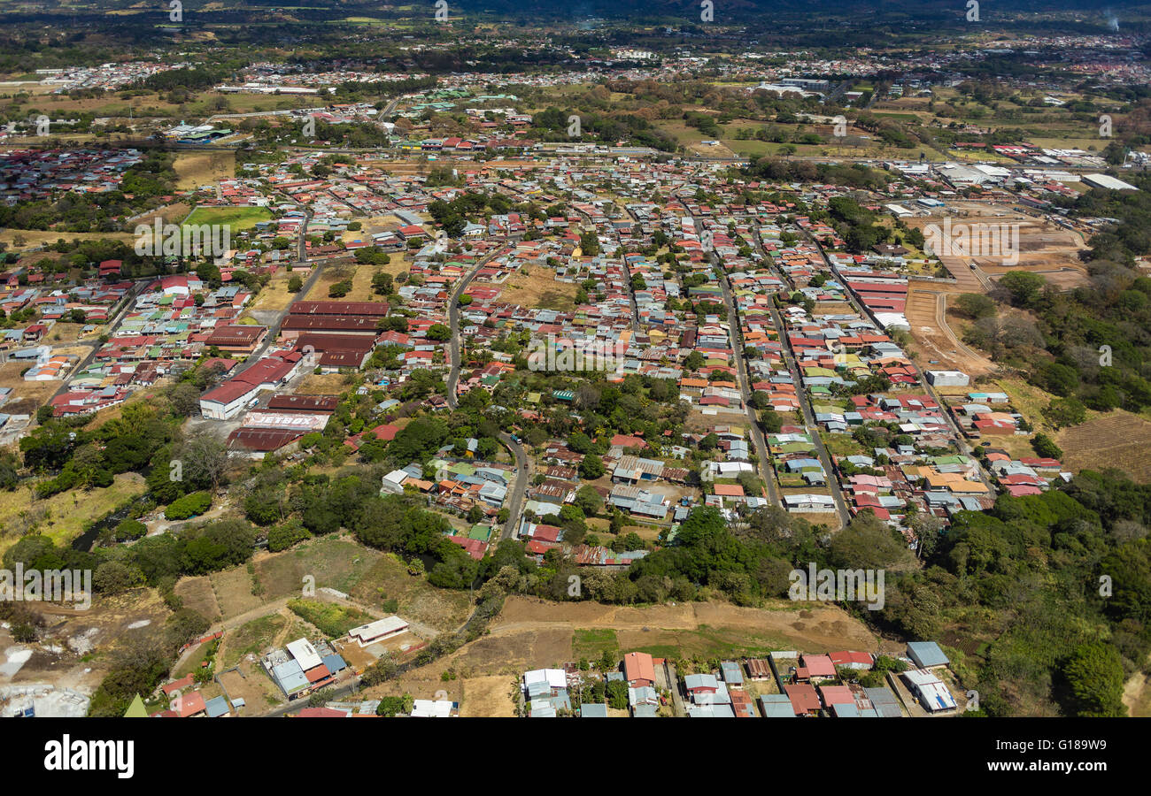 ALAJUELA, COSTA RICA - aerial view of housing and commercial activity ...