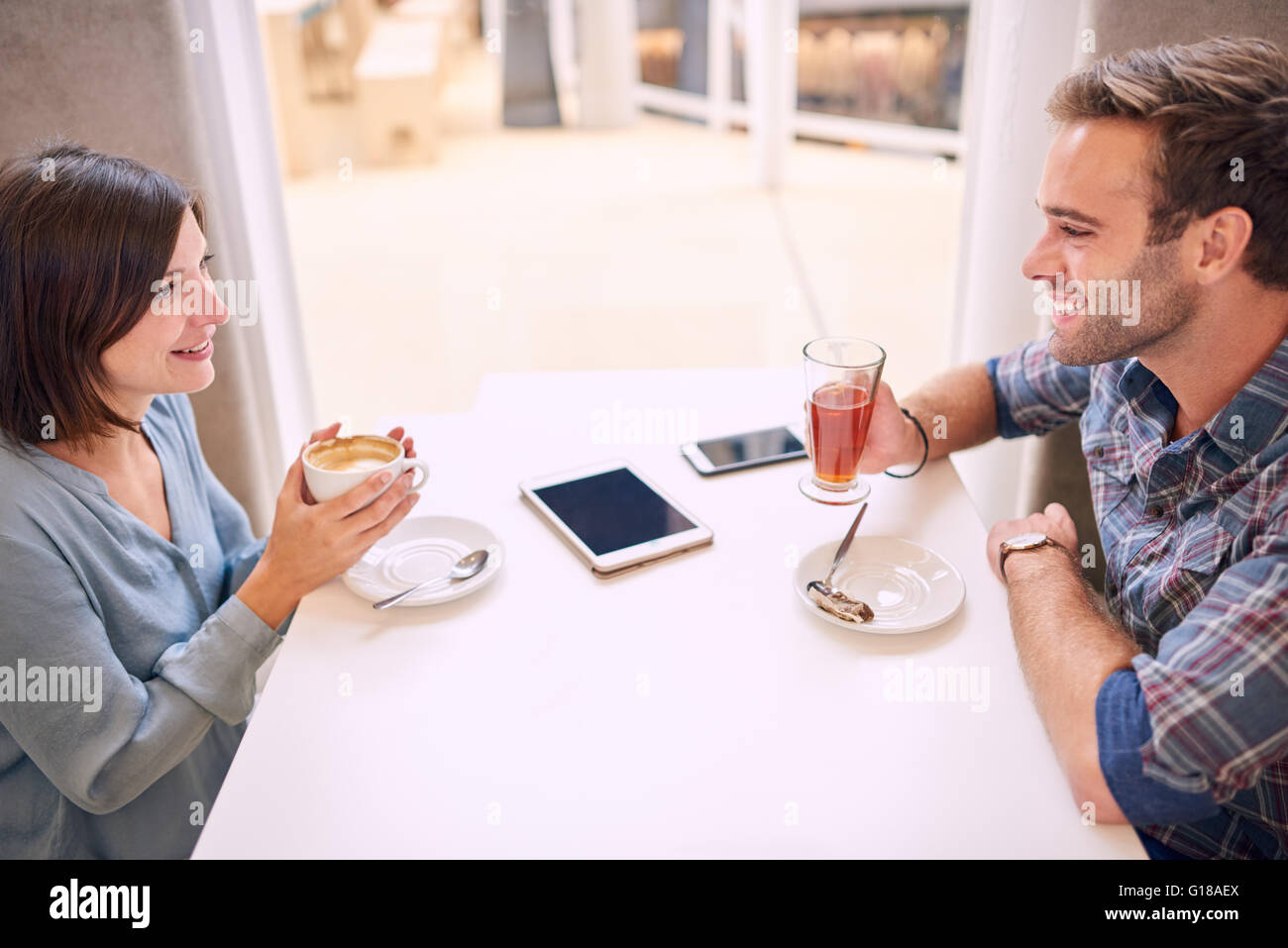 Couple sitting across from each other hi-res stock photography and ...
