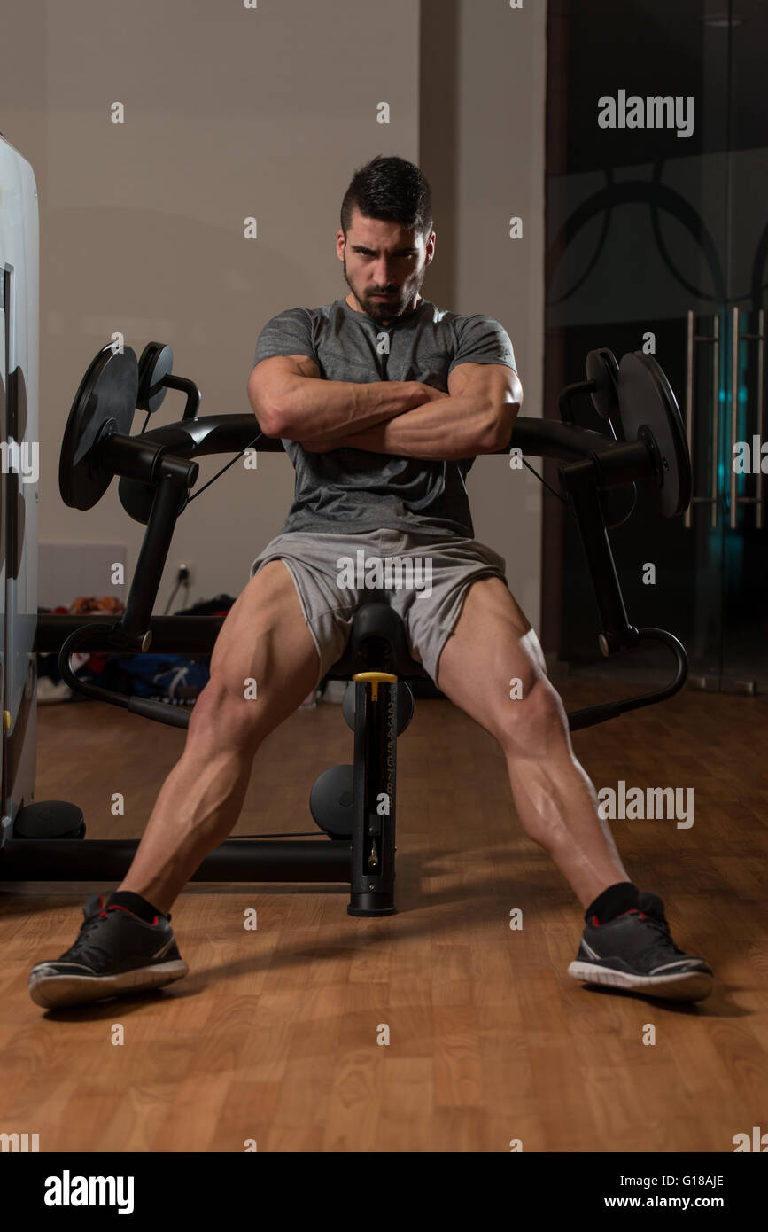 Portrait Of A Young Muscular Athletic Man Posing While Sitting And ...