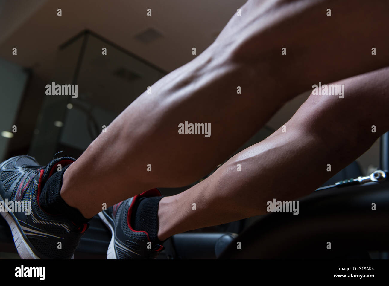 Bodybuilder Doing Heavy Weight Exercise For Legs Stock Photo - Alamy