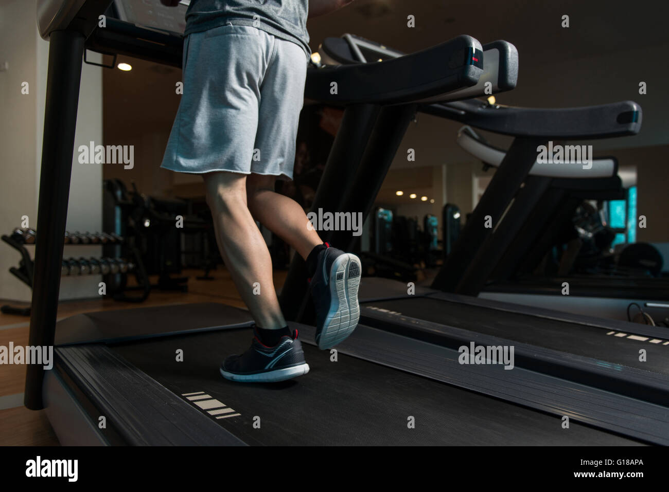 Close Up Of Male Legs Running On Treadmill - Blurred Motion Stock Photo ...